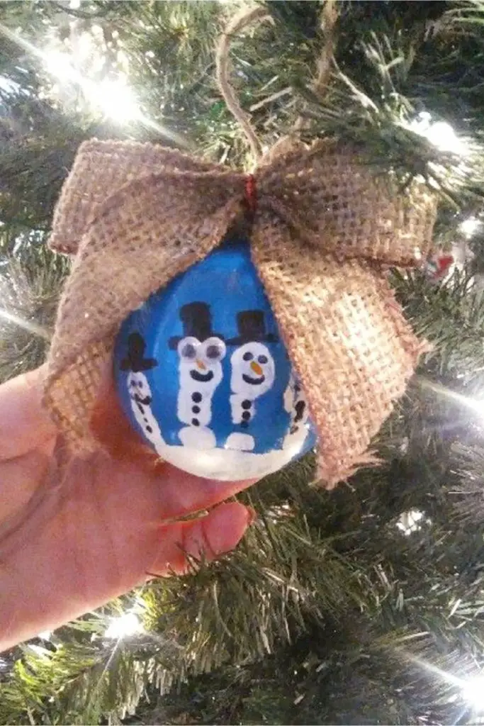 The CUTEST Snowman Handprint Ornaments To DIY With Your Kids